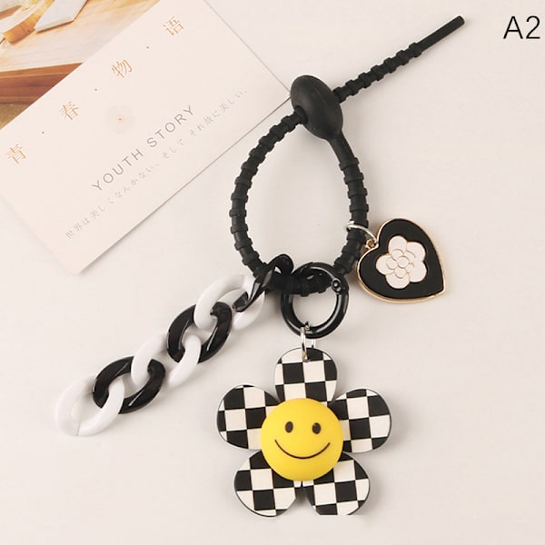 Trendig solblomma Smiley nyckelring Leende blomma nyckelring med H A2 ...
